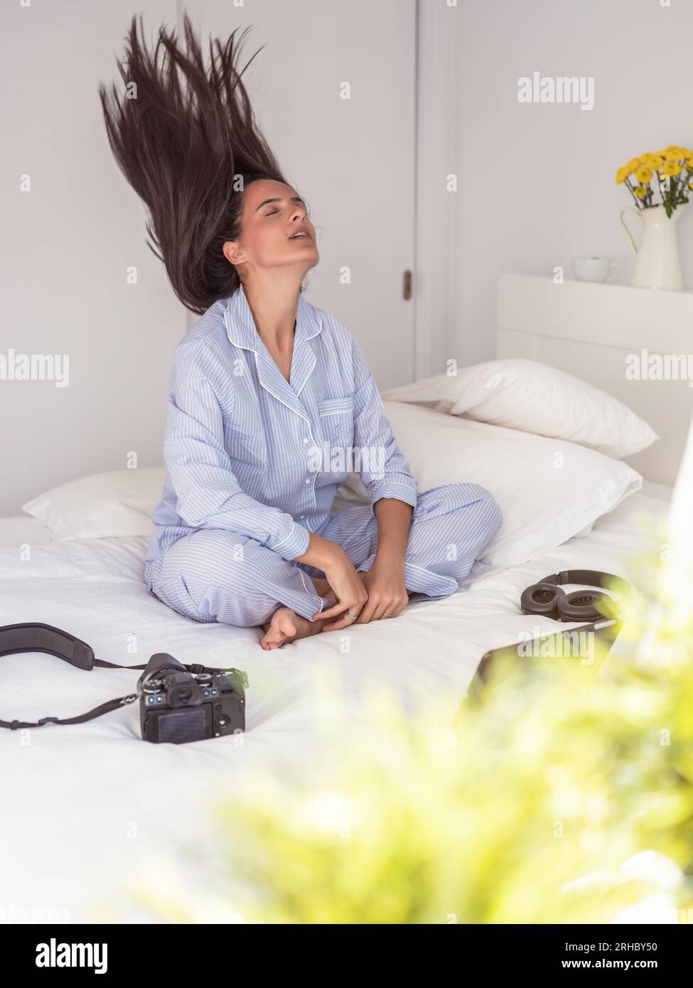 Full Body Of Barefoot Brunette With Long Flying Hair And In Nightwear Throwing Head Back While