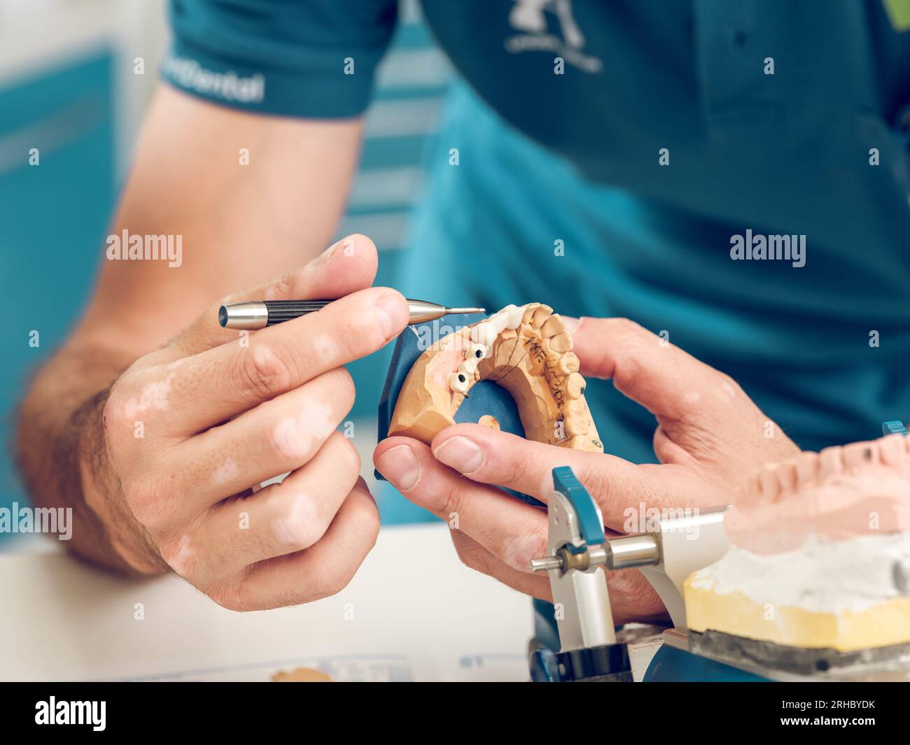 Closeup of crop anonymous male orthodontist using dental tools while ...