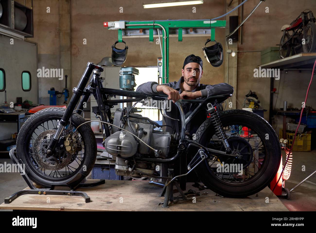 Portrait man leaning on motorcycle hi-res stock photography and images ...