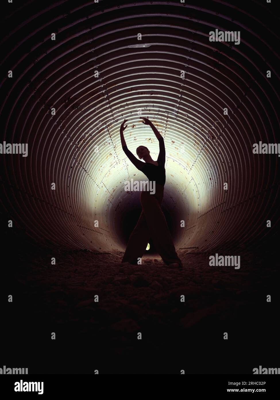 Full body of talented female ballet dancer in pointe shoes dancing in ...