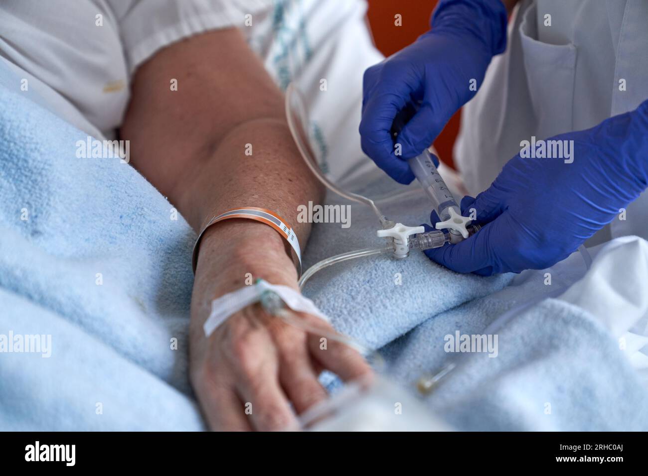 From above of crop unrecognizable nurse in gloves giving drug ...
