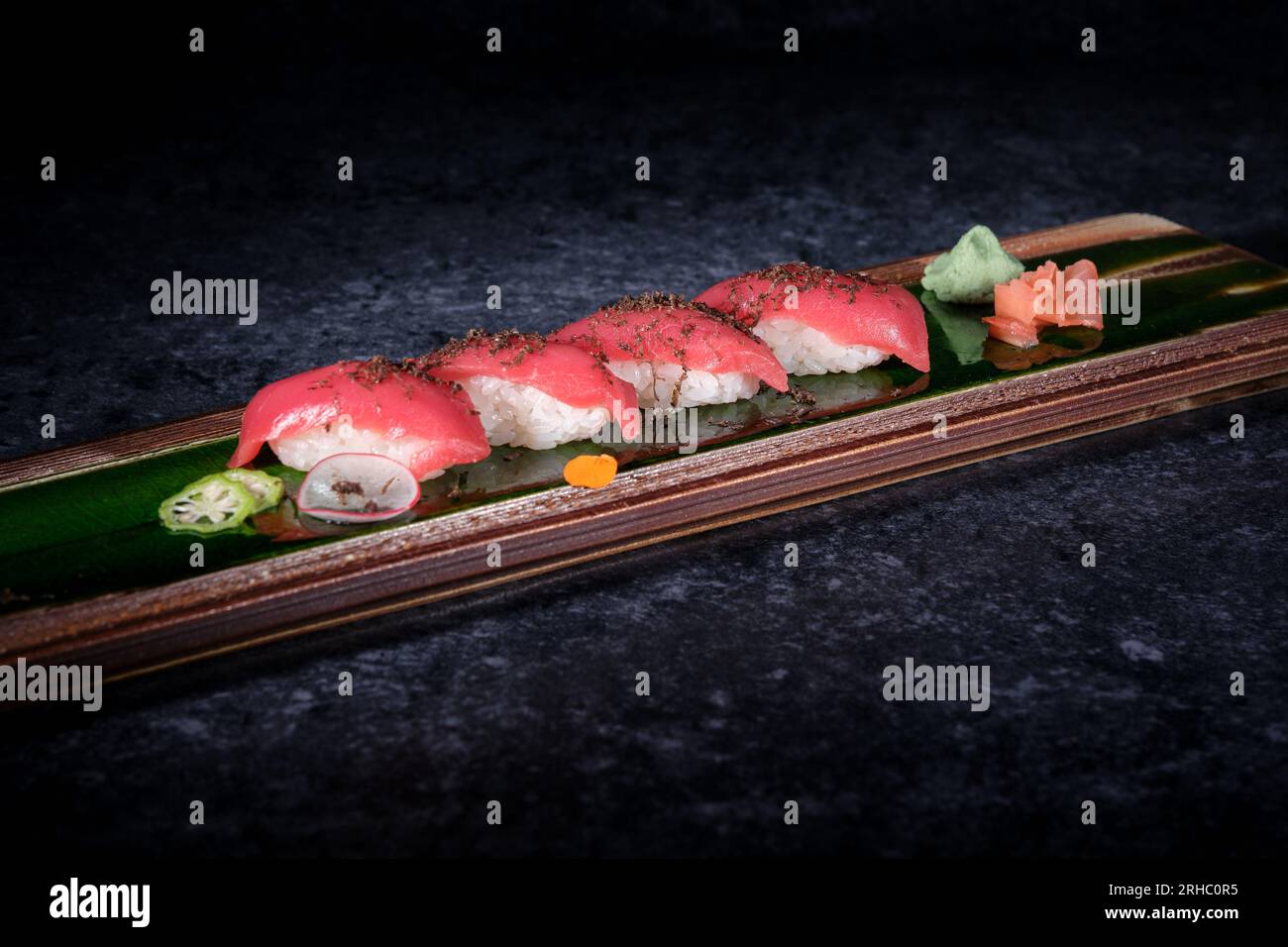 Yummy Japanese sushi nigiri with fresh fish and rice decorated with ...