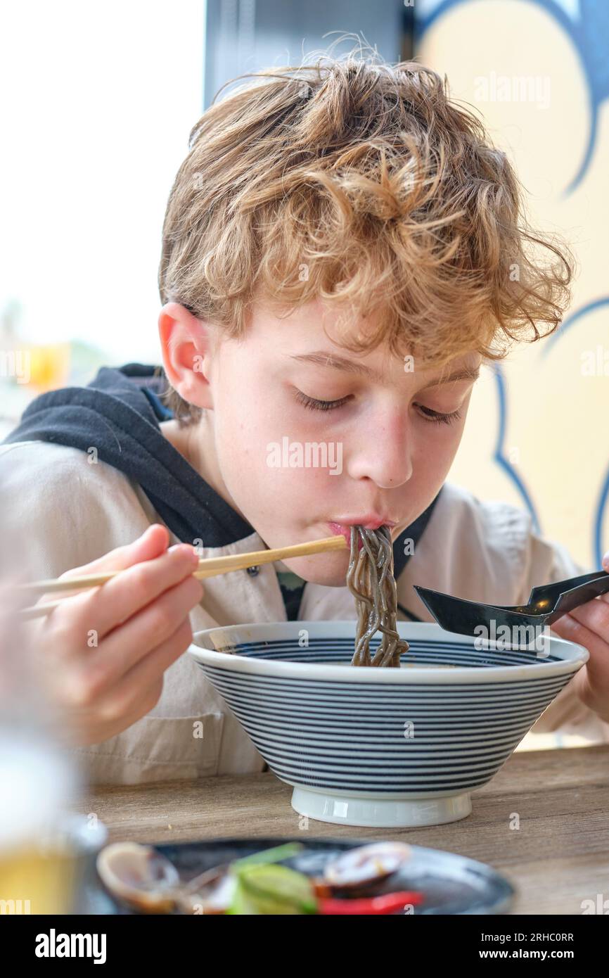 Asian boy noodles hi-res stock photography and images - Alamy