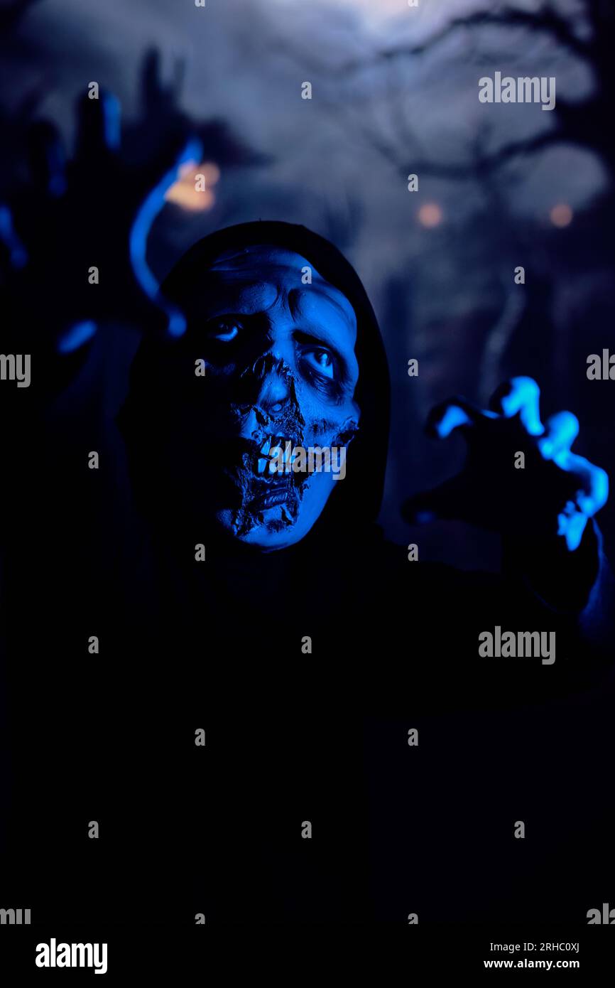 Awful undead monster stretching out arms and limping towards camera ...