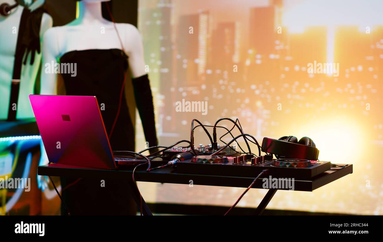 Empty DJ mixing station at nightclub, stage lights and disco music at ...