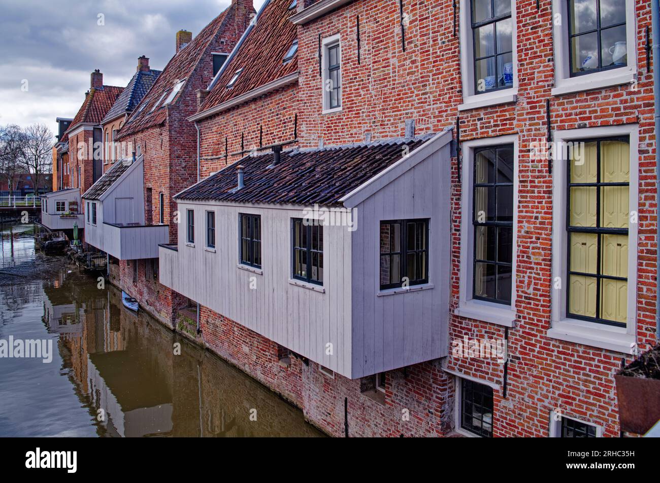 Houses along a Canal in the city, Appingedam, Groningen, Holland Stock ...