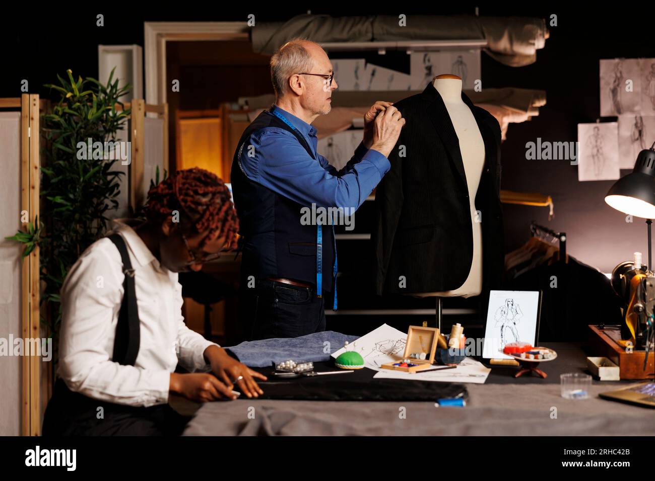Fashion designer making adjustments hi-res stock photography and images ...