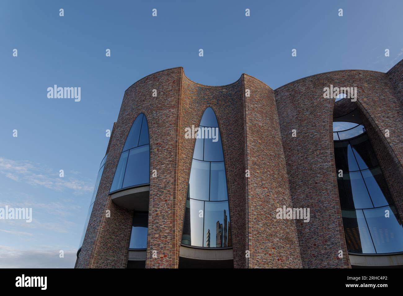 Vejle, Denmark - 06 OCTOBER 2022: Outdoor exterior view and detail of curvature brick wall and ...
