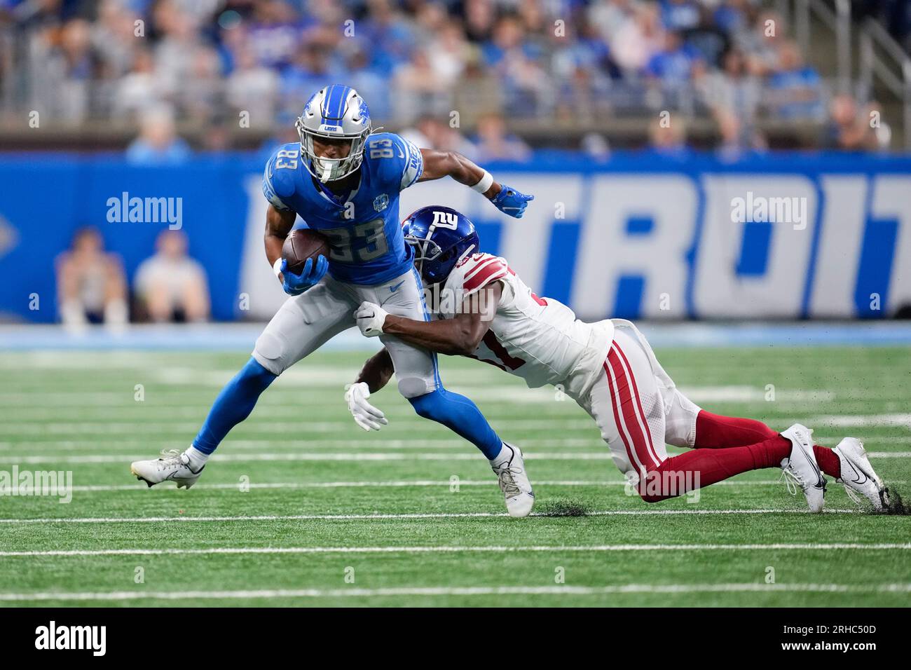Detroit Lions wide receiver Dylan Drummond (83) tries to break the tackle of New York Giants ...