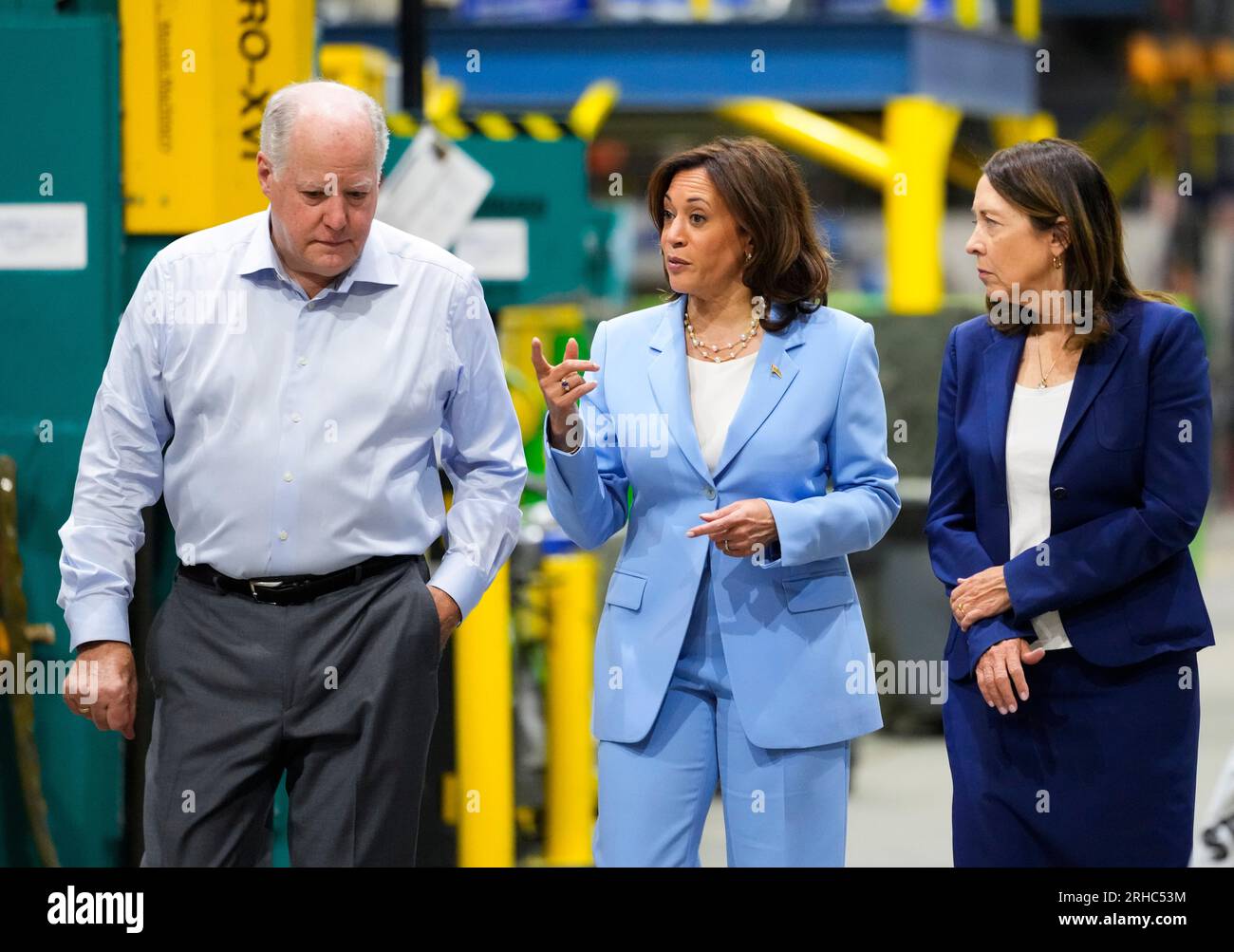 Vice President Kamala Harris, center, tours McKinstry's facilities with CEO Dean Allen, left ...