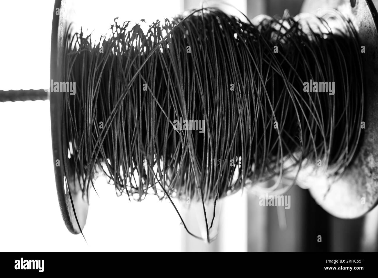 Silhouette spool of thick wire on a spindle Stock Photo - Alamy