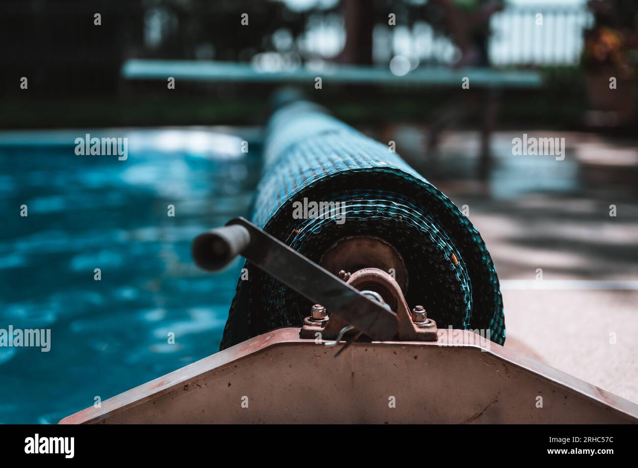 Manual real for a retractable floating pool cover to keep out leaves ...