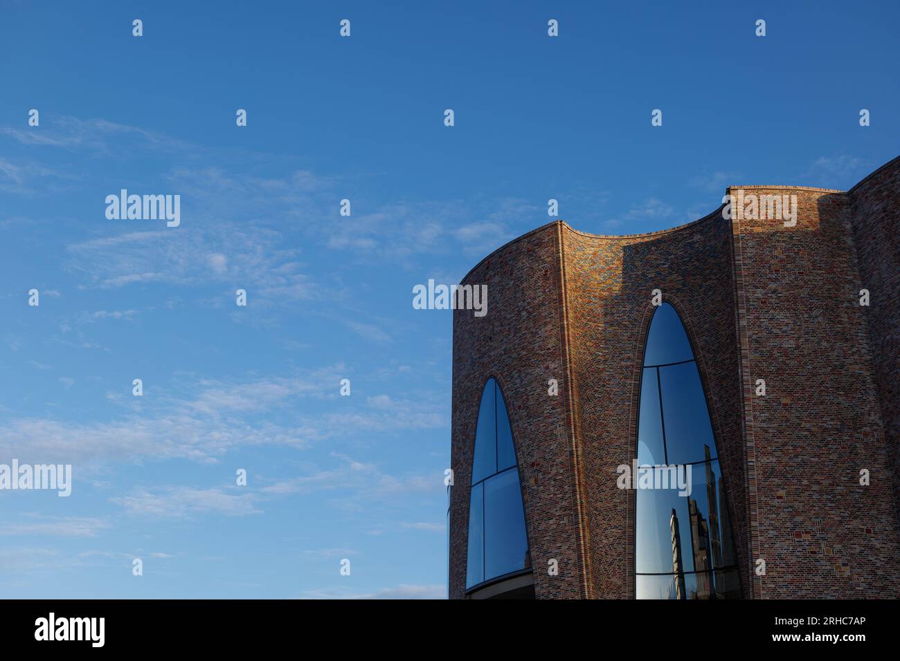Vejle, Denmark - 06 OCTOBER 2022: Outdoor exterior view and detail of curvature brick wall and ...