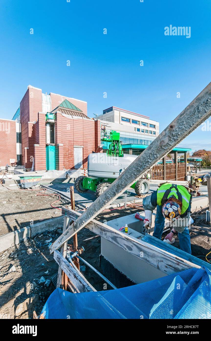 Construction workers and equipment at a building project construction ...