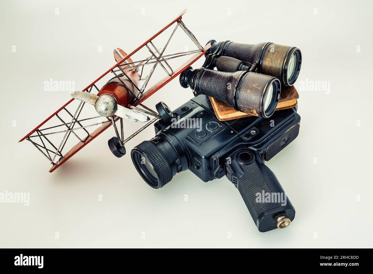 Romantic ideals of adventure depicted with vintage cameras, aircraft ...