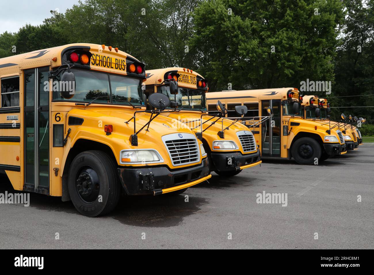 School buses are seen parked at Bloomsburg High School as many school ...