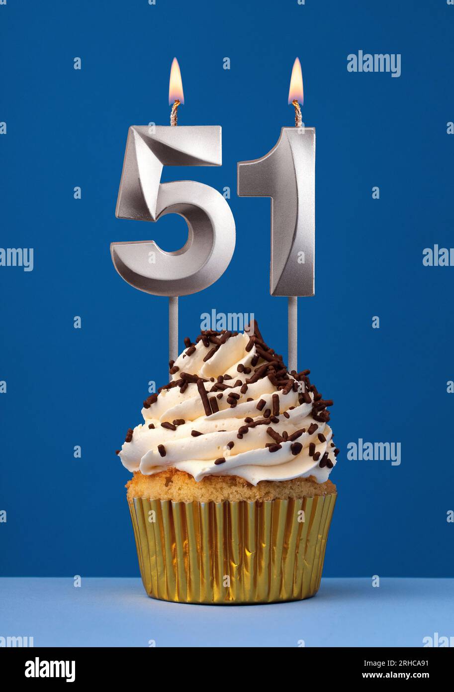 Burning candle number 51 - Birthday card with cake on blue Background ...
