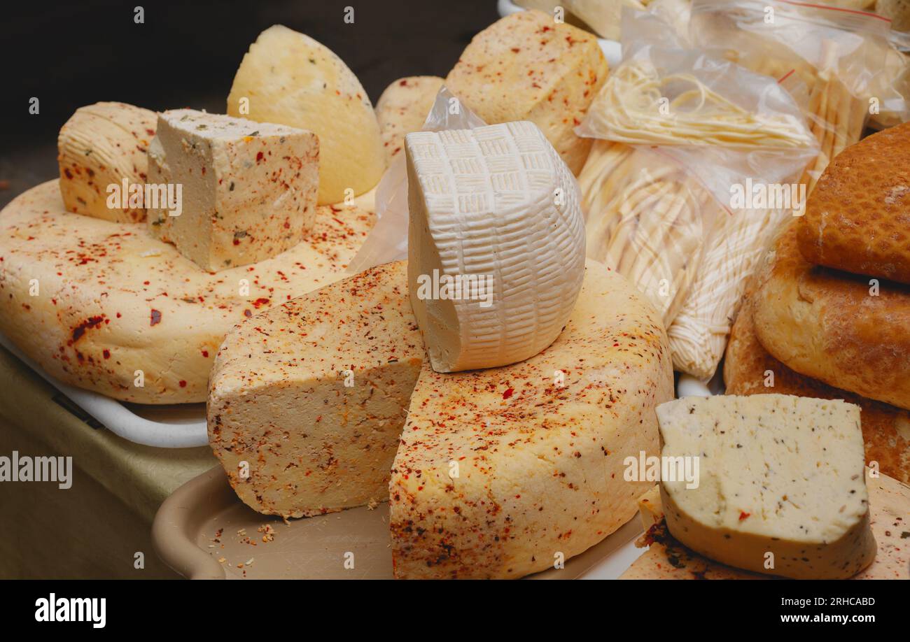 Homemade different cheeses on the market Stock Photo - Alamy