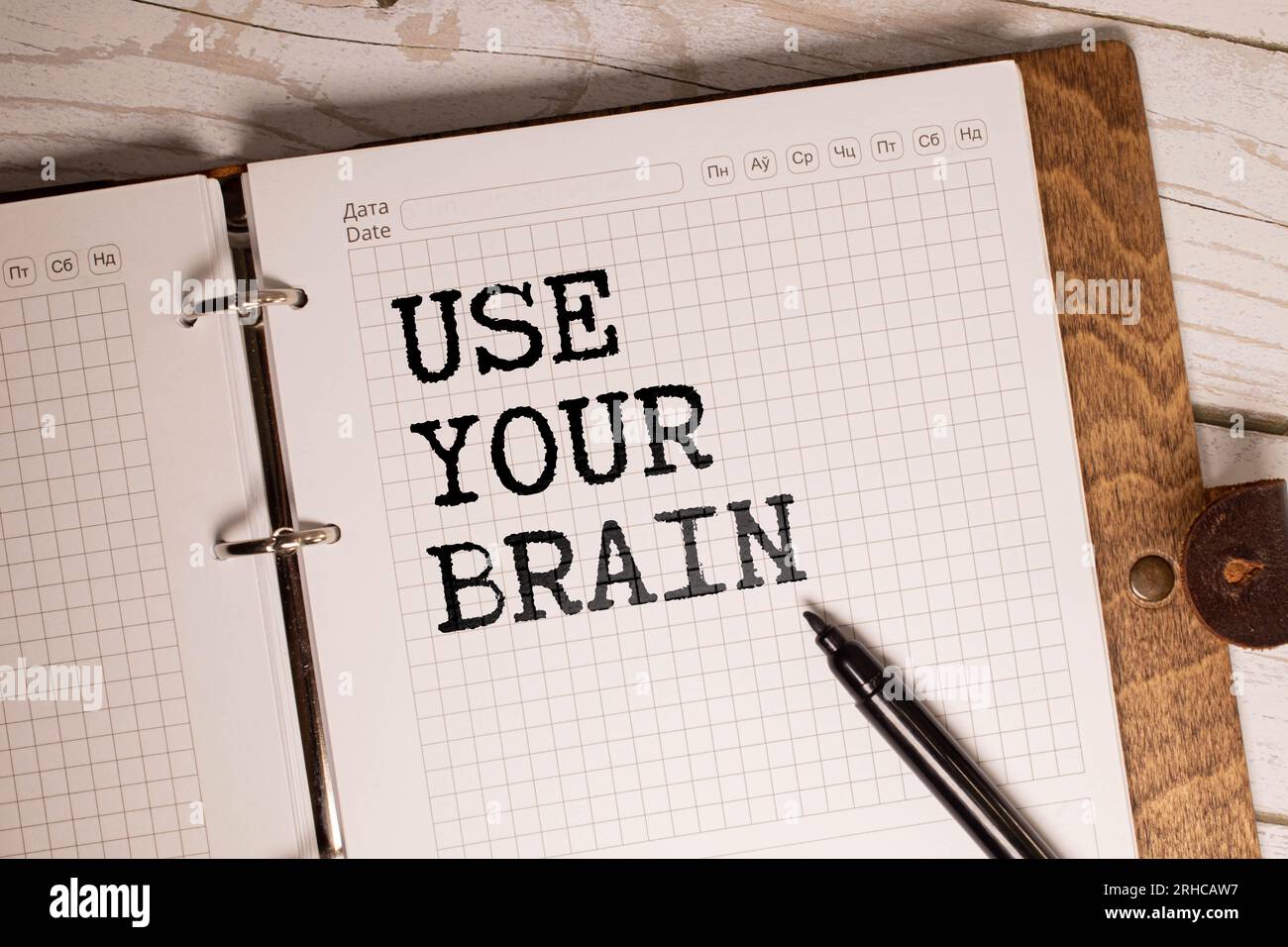 The phrase Use Your Brain in blue text on an index card pinned to a ...