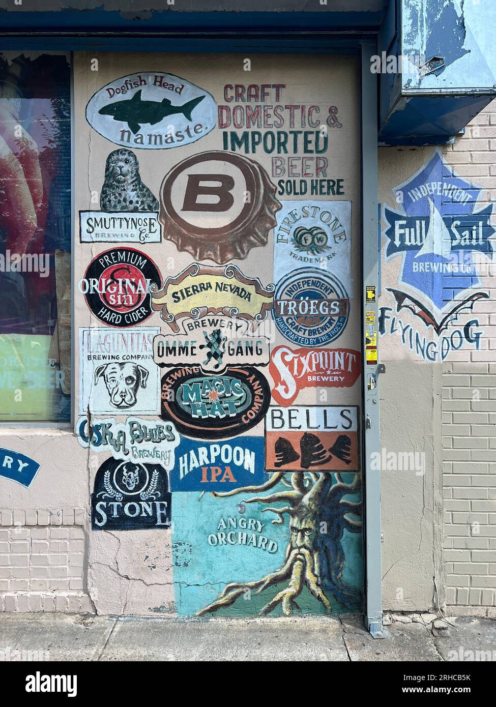 Names of of small independent breweries on display on the side of a ...