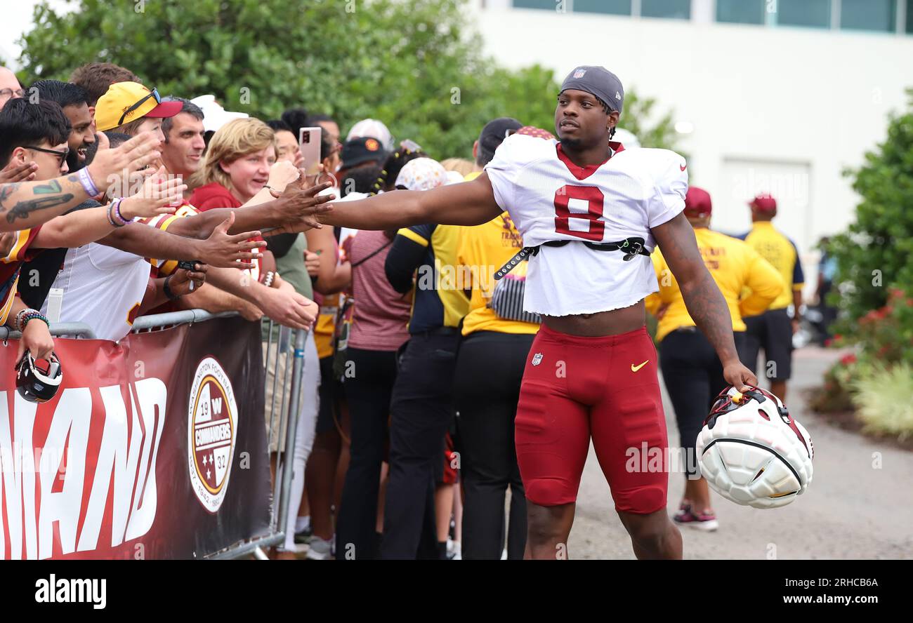 Washington Commanders running back Brian Robinson Jr (8) high fives ...