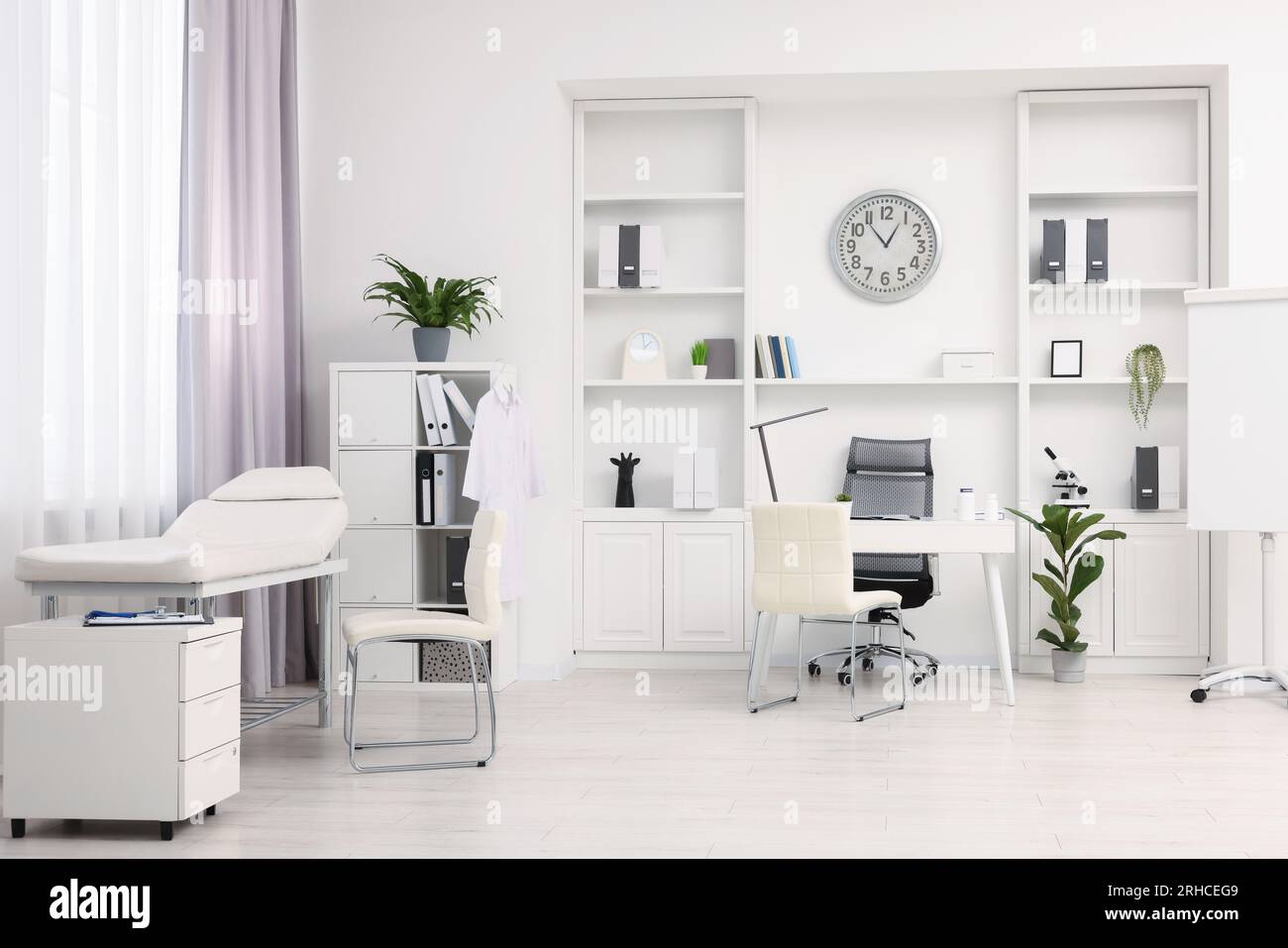 Modern medical office interior with doctor's workplace and examination ...