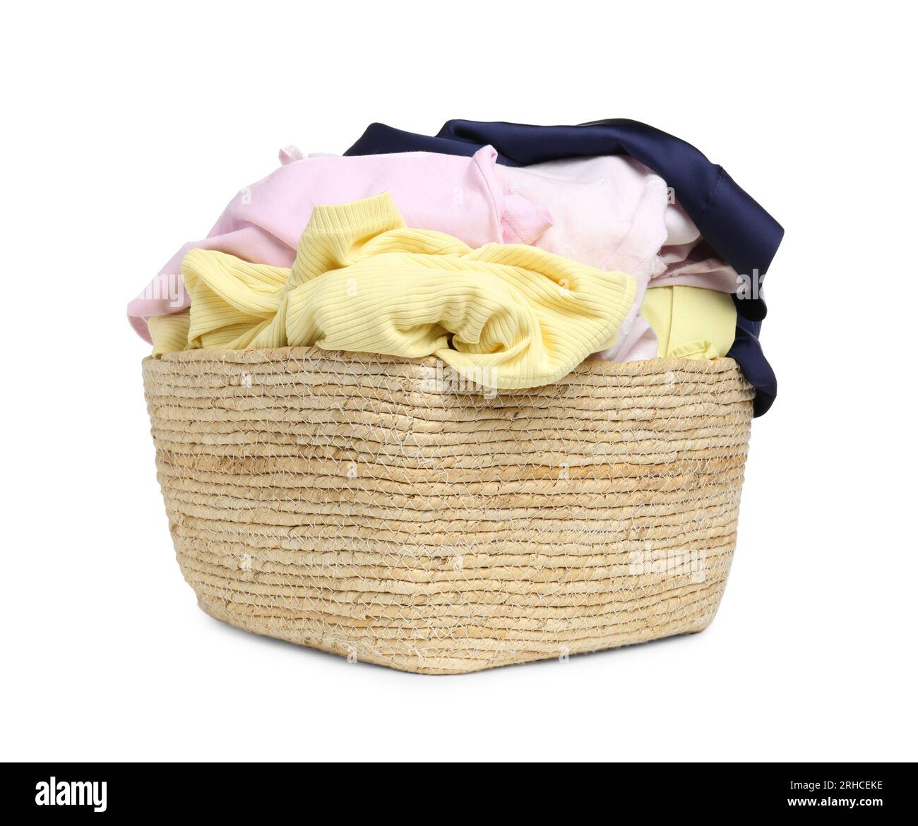 Wicker laundry basket with clean colorful clothes isolated on white ...
