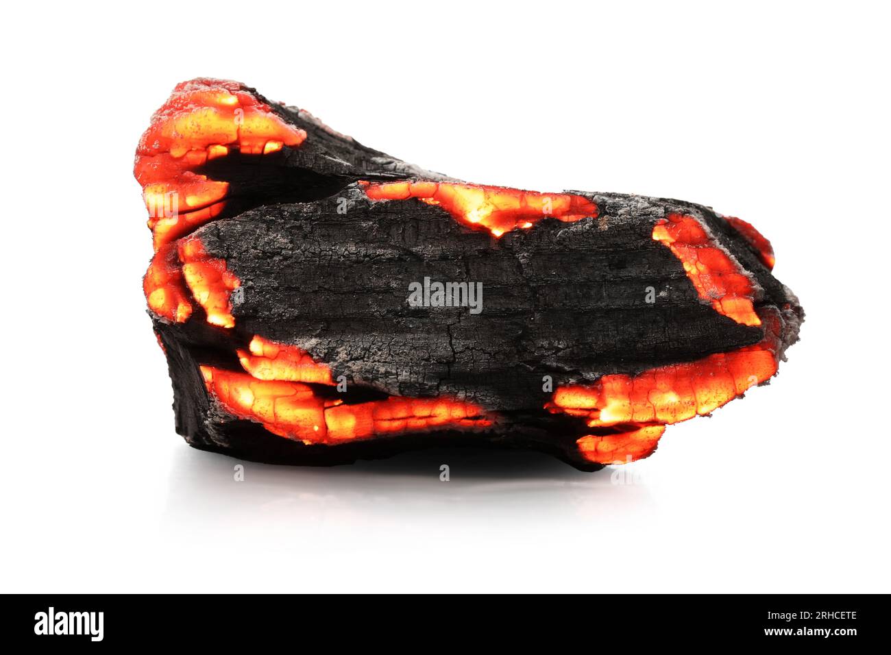 Piece of smoldering coal on white background Stock Photo - Alamy