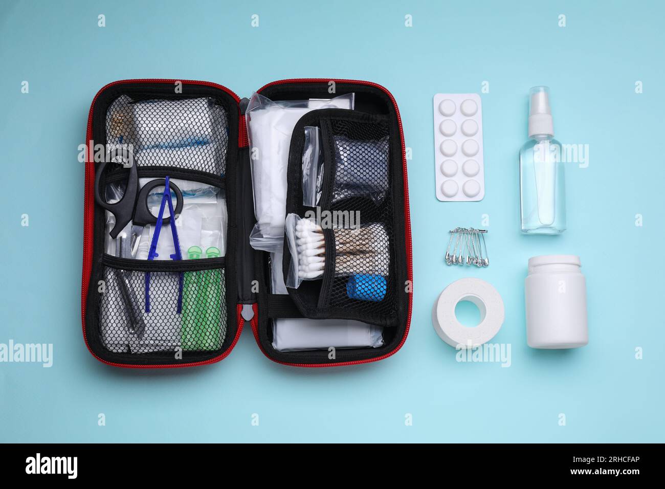 Flat lay composition with first aid kit on light blue background Stock ...