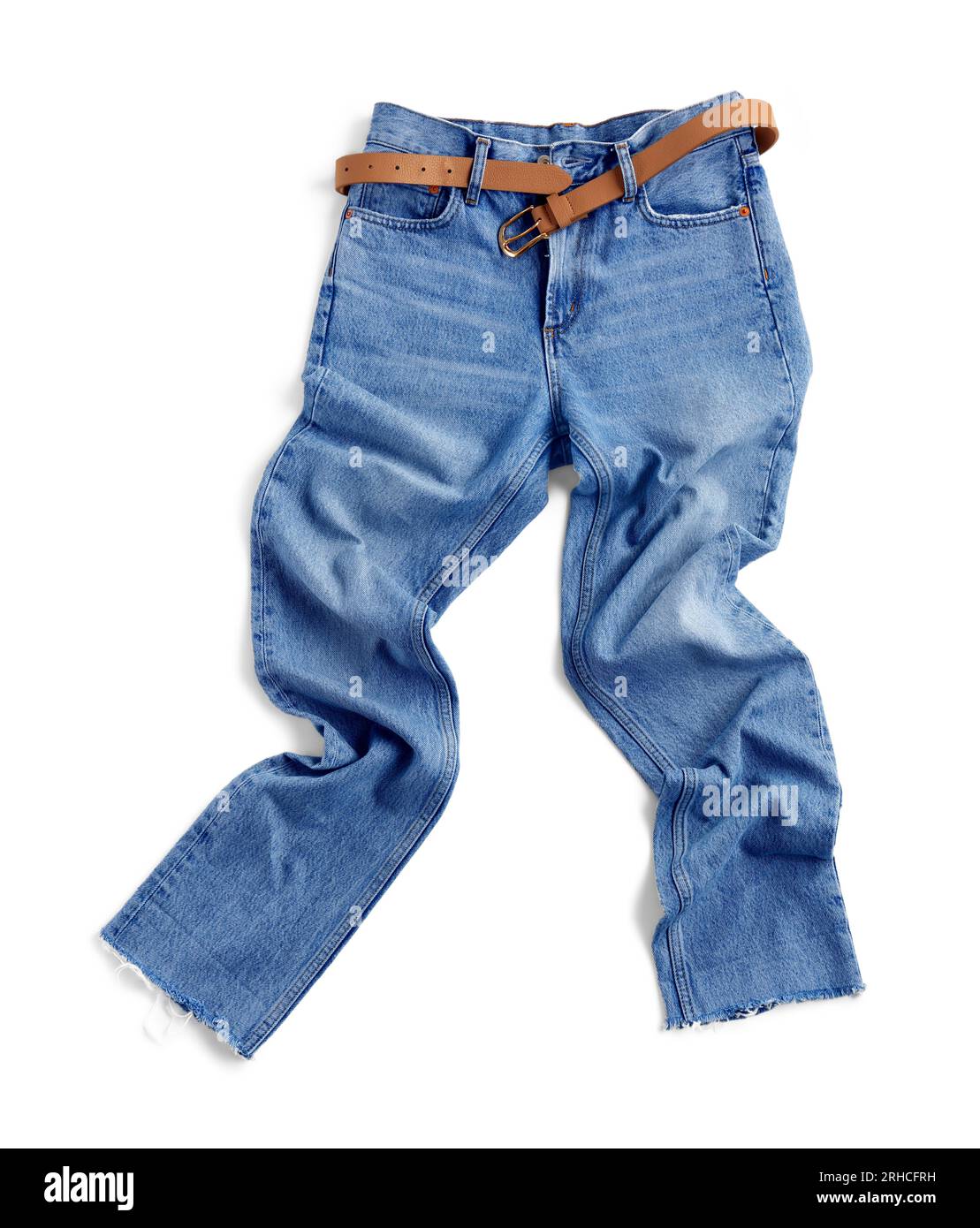 Rumpled light blue jeans with belt isolated on white, top view. Stylish ...