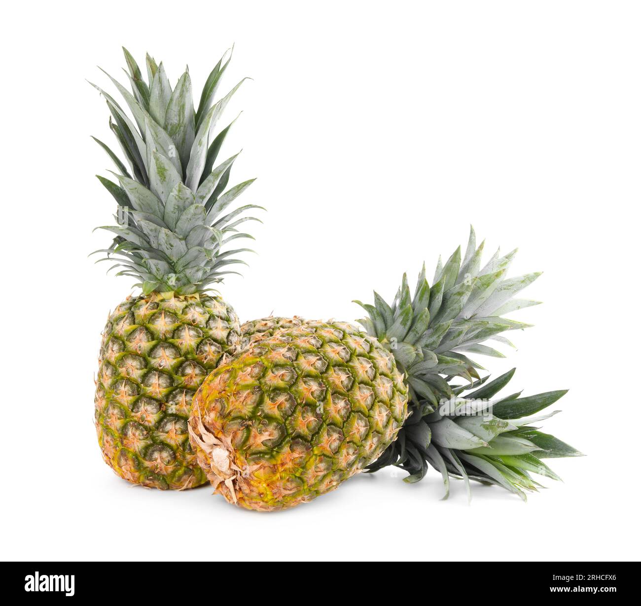 Two delicious ripe pineapples isolated on white Stock Photo - Alamy