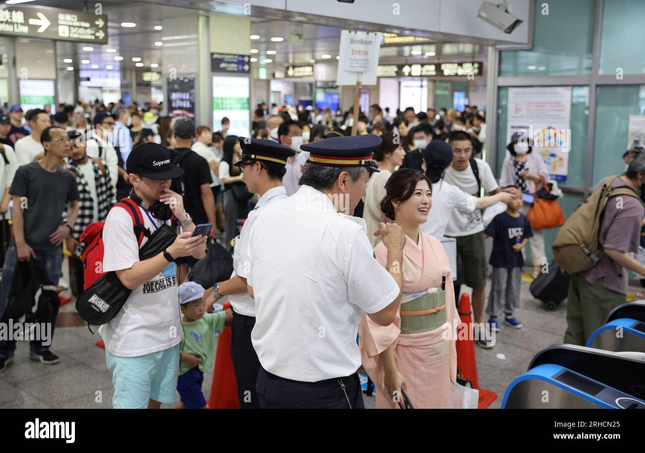 Passengers are seen at ticket gates of Shinkansen Bullet Train that ...