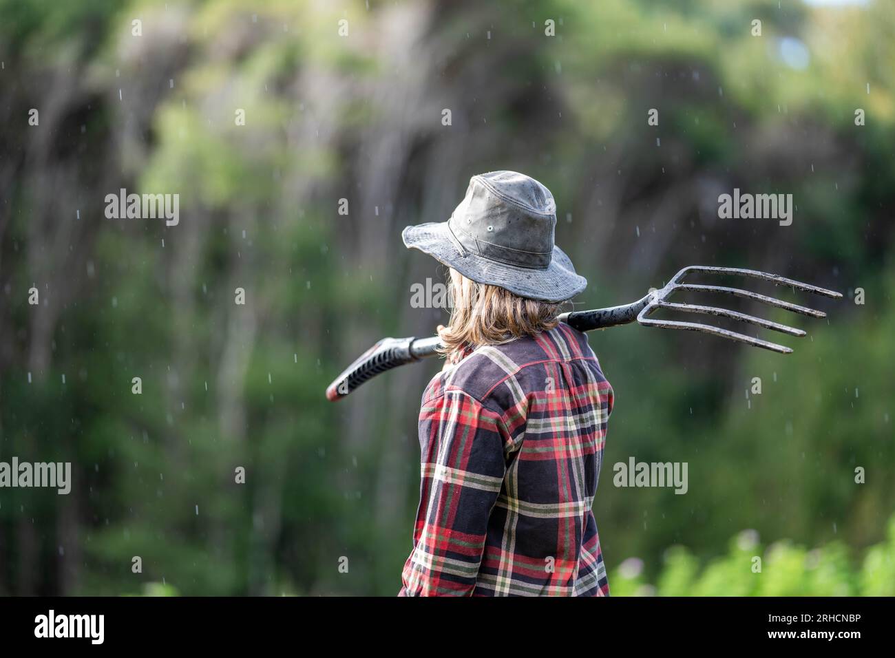 female gardener with a pitchfork in the netherlands Stock Photo - Alamy