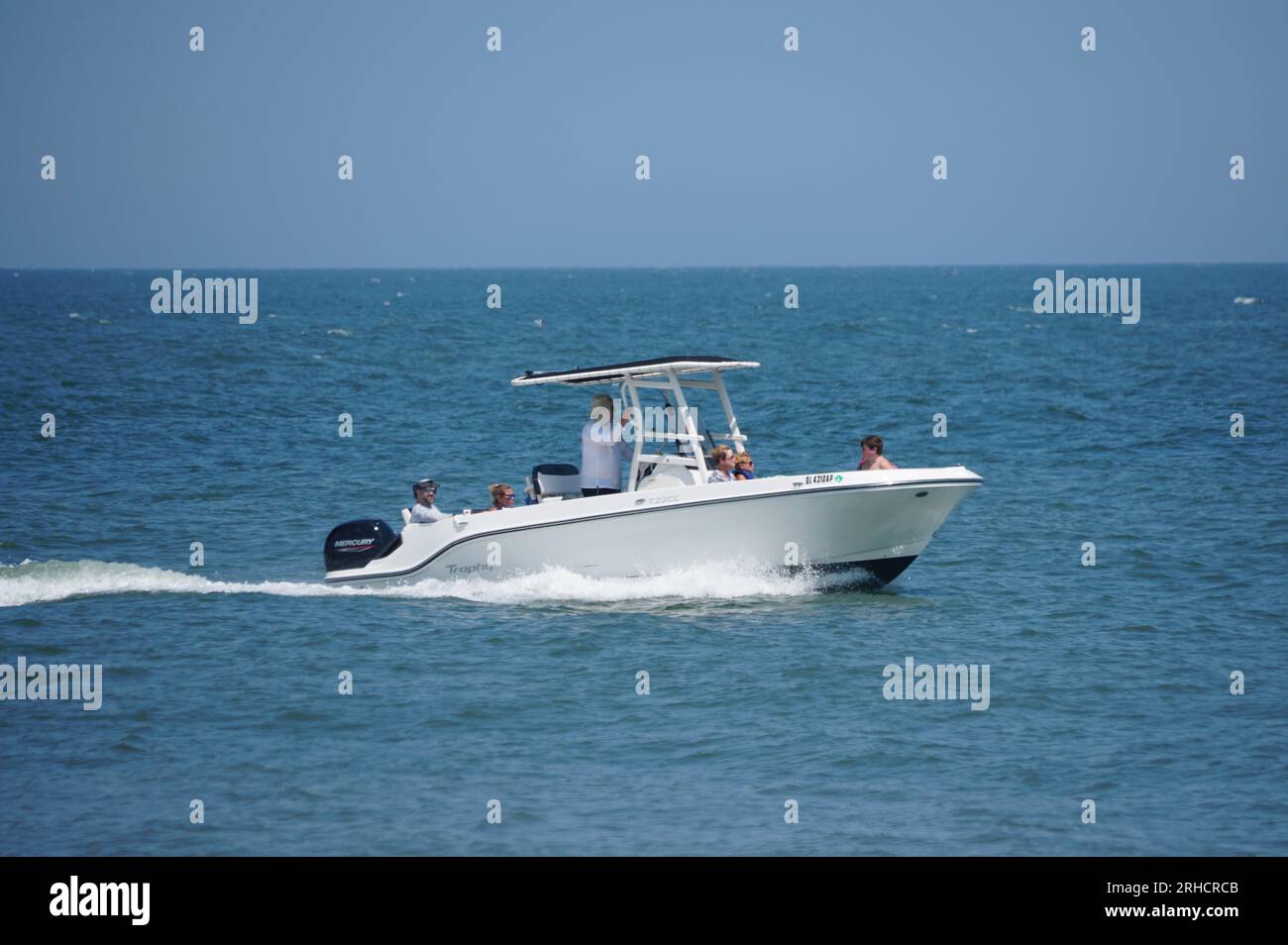 Rehoboth Beach, Delaware, U.S.A - August 12, 2023 - A white boat moving ...