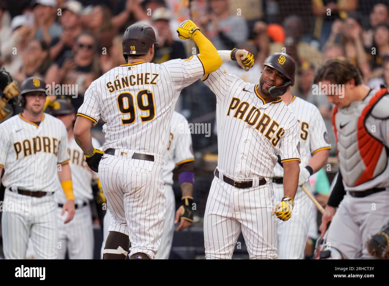San Diego Padres' Gary Sanchez (99) is greeted by teammate Xander ...
