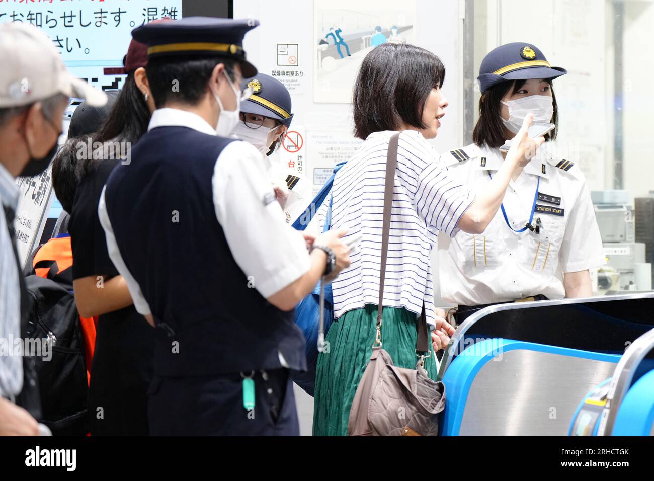 Passengers wait for the resumption of operation of Shinkansen Bullet Train at JR Tokyo Station ...