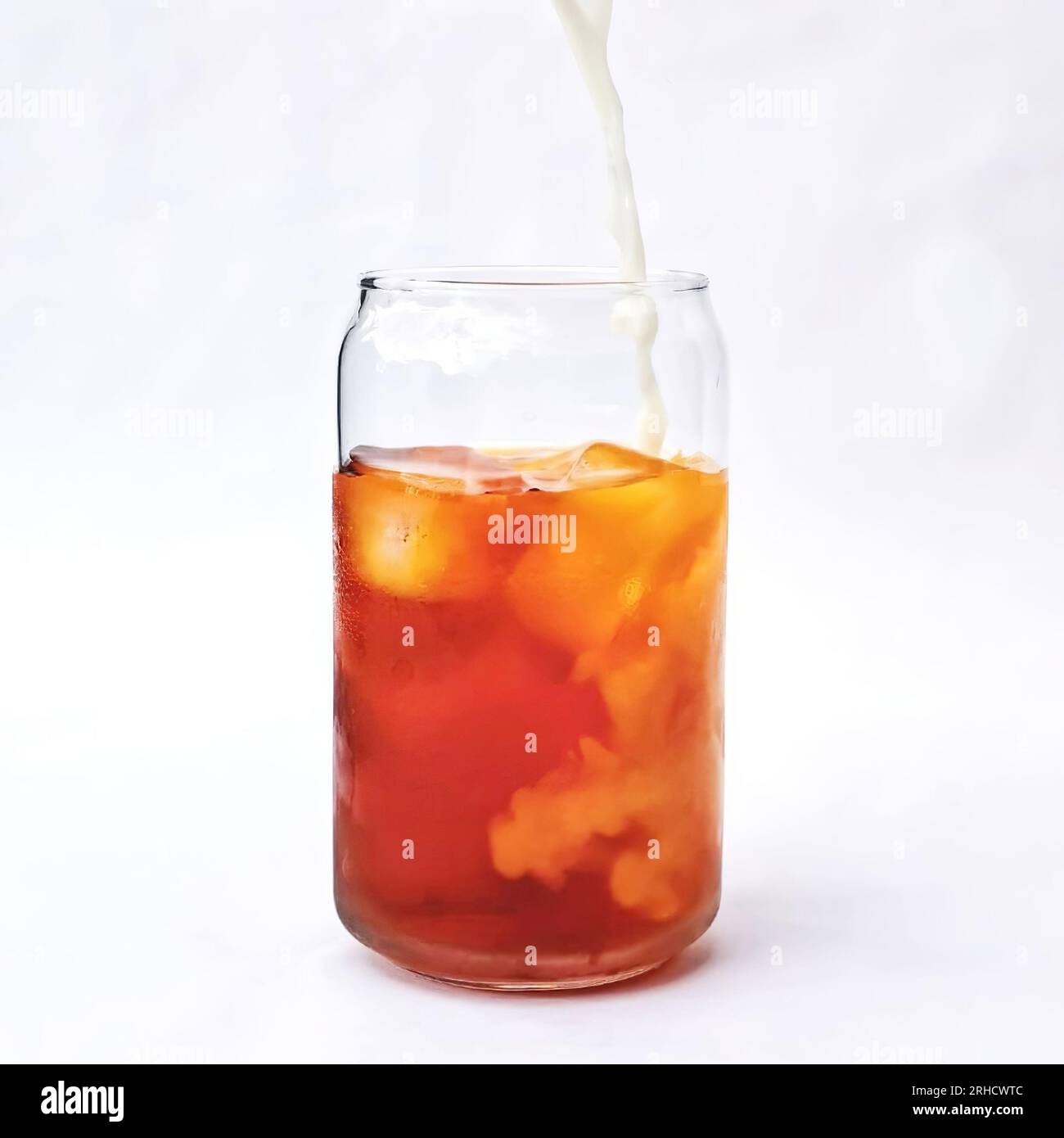 cold brew, cold coffee with mineral water and orange, pouring milk on a ...