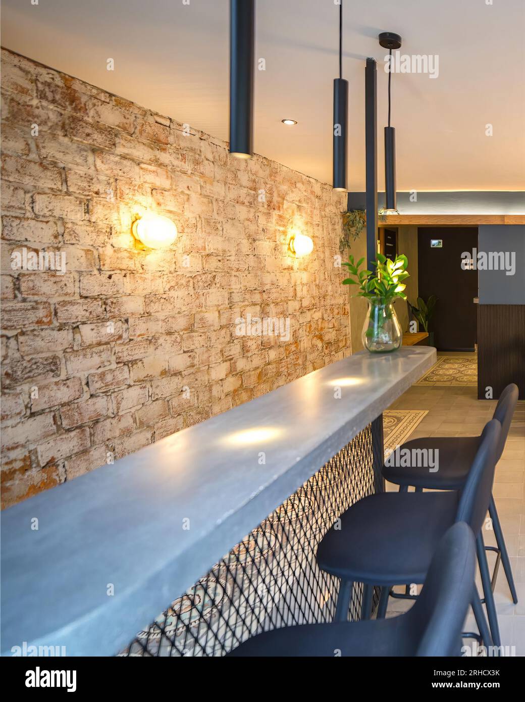 polished concrete bar with wall background wall exposed in its bricks ...