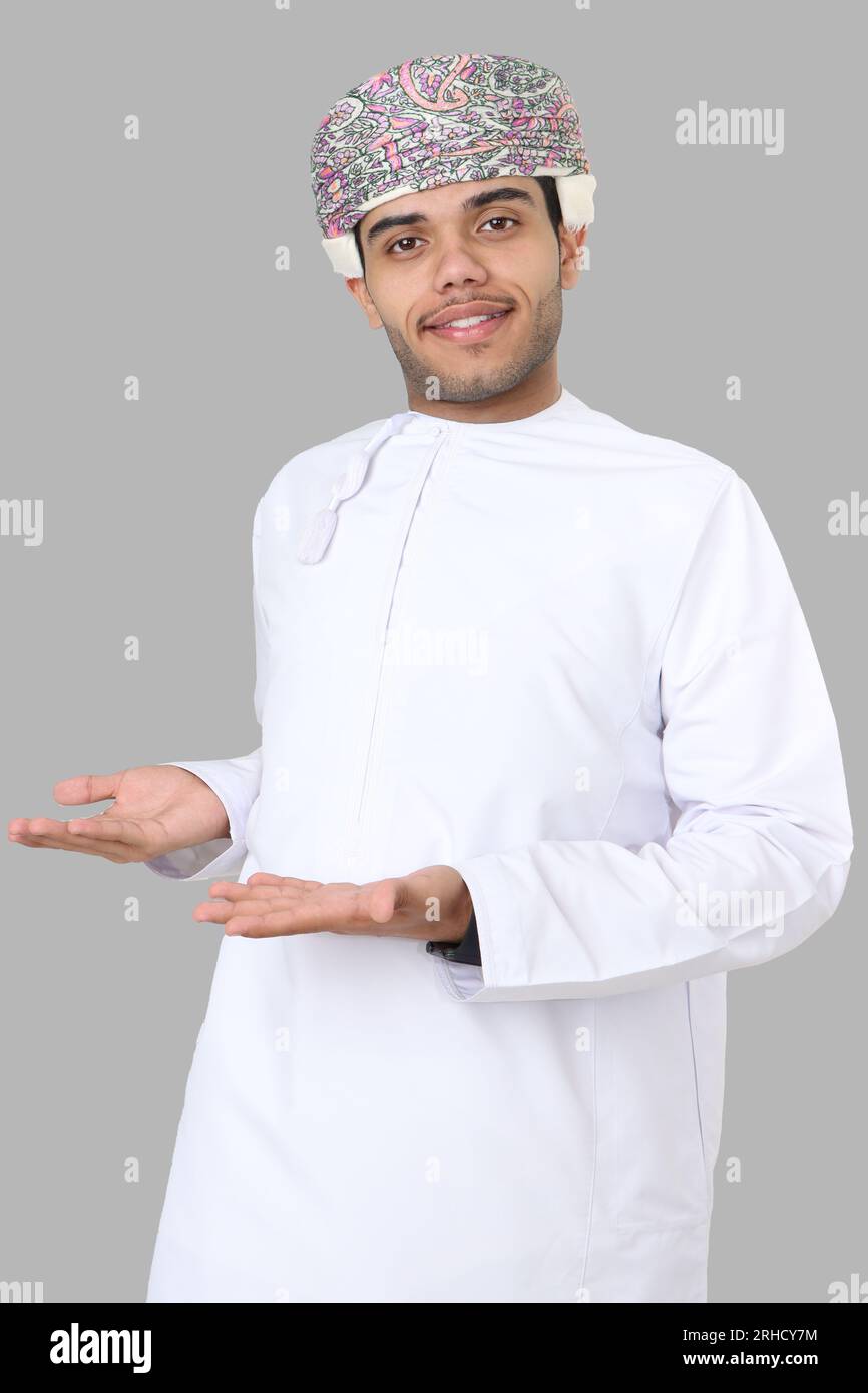 Omani Man making hand gesture Stock Photo - Alamy