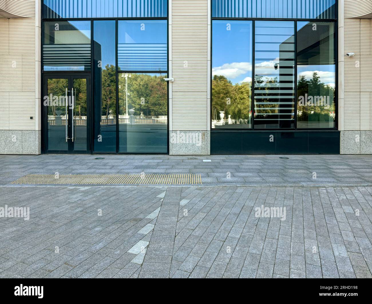 entrance of office building with street reflections. modern urban ...