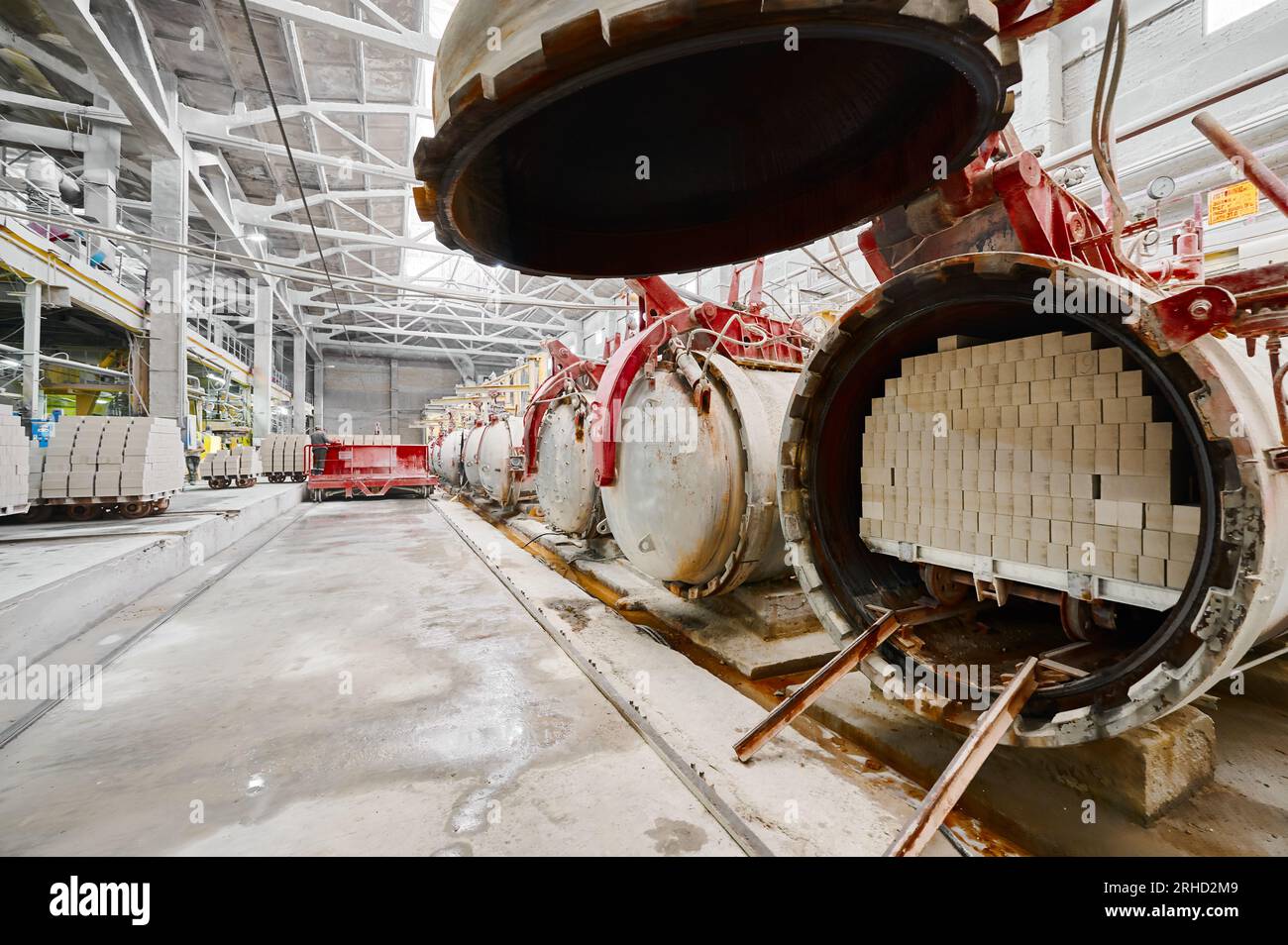 Raw bricks loaded into open autoclave for hardening in shop Stock Photo ...
