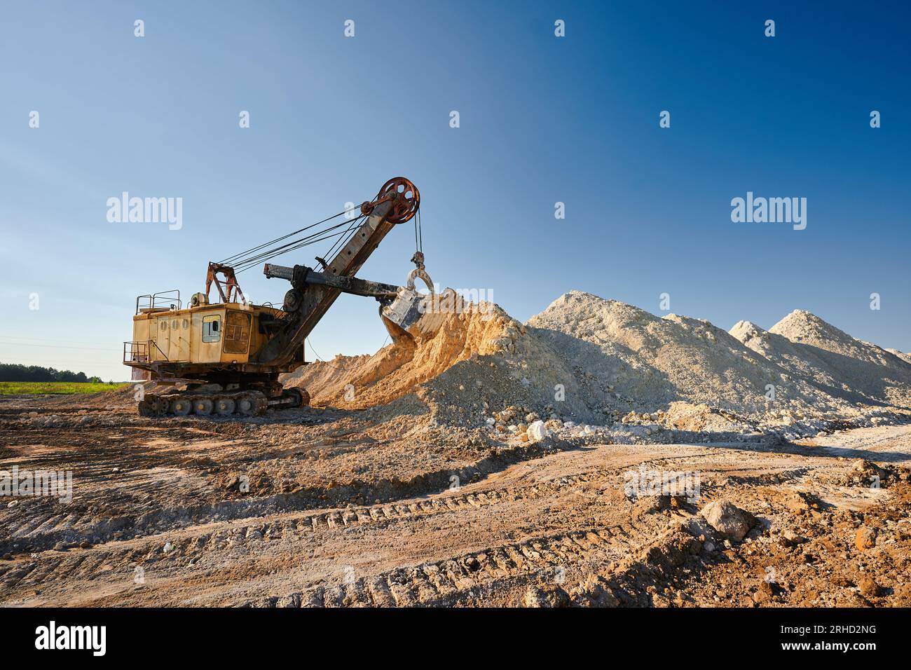Shovel mining excavator operates in large open chalk quarry Stock Photo ...