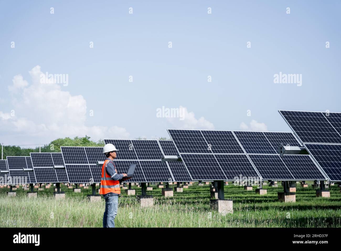 The solar farm(solar panel) with engineers check the operation of the ...