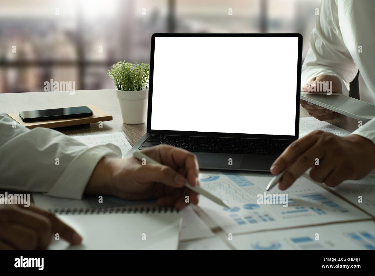 Laptop with blank screen on table. Workspace background new project on ...