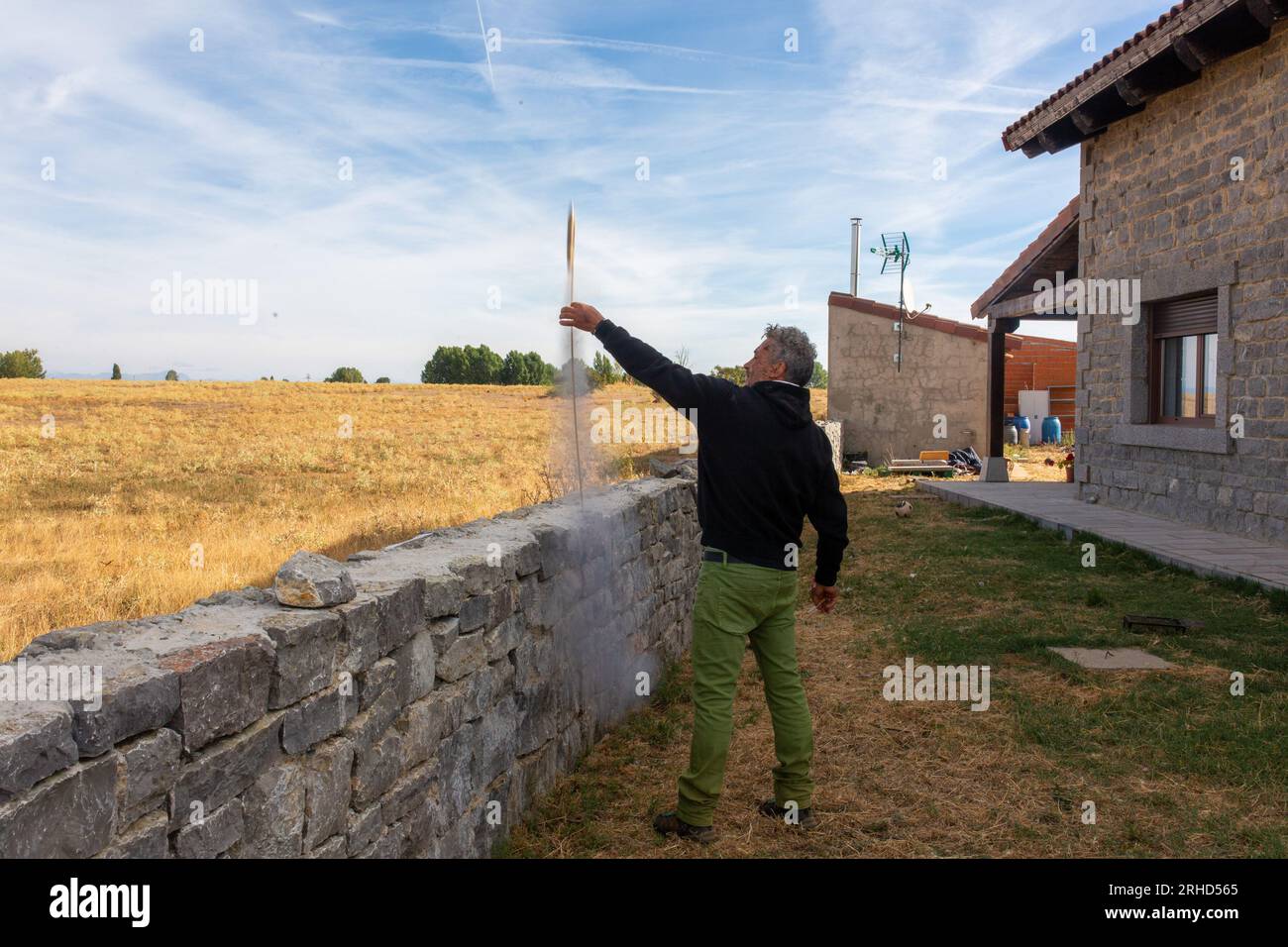 A man throws a firecracker, which indicates to the residents that the ...