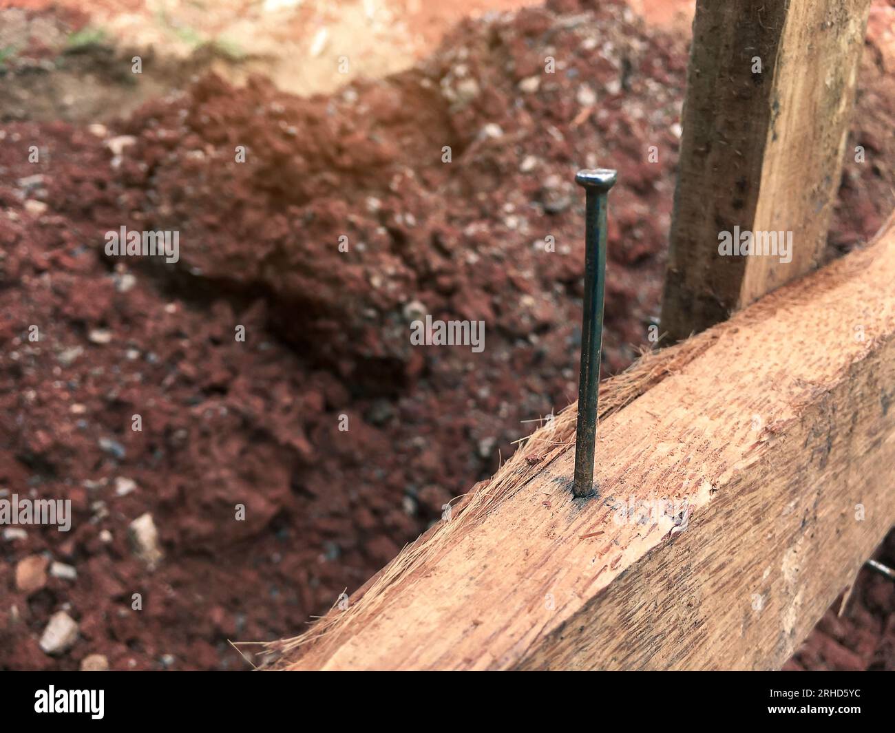 Concrete nails that are driven into the chart wood to tie ropes that ...