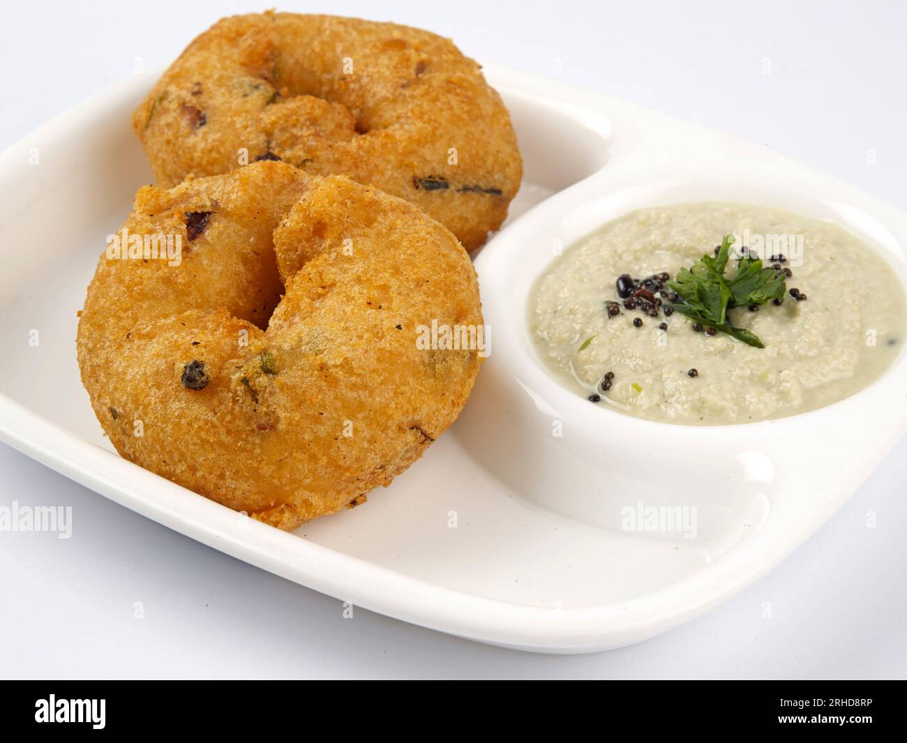 Ulunthu vadai with coconut chutney served in dip plate Stock Photo - Alamy