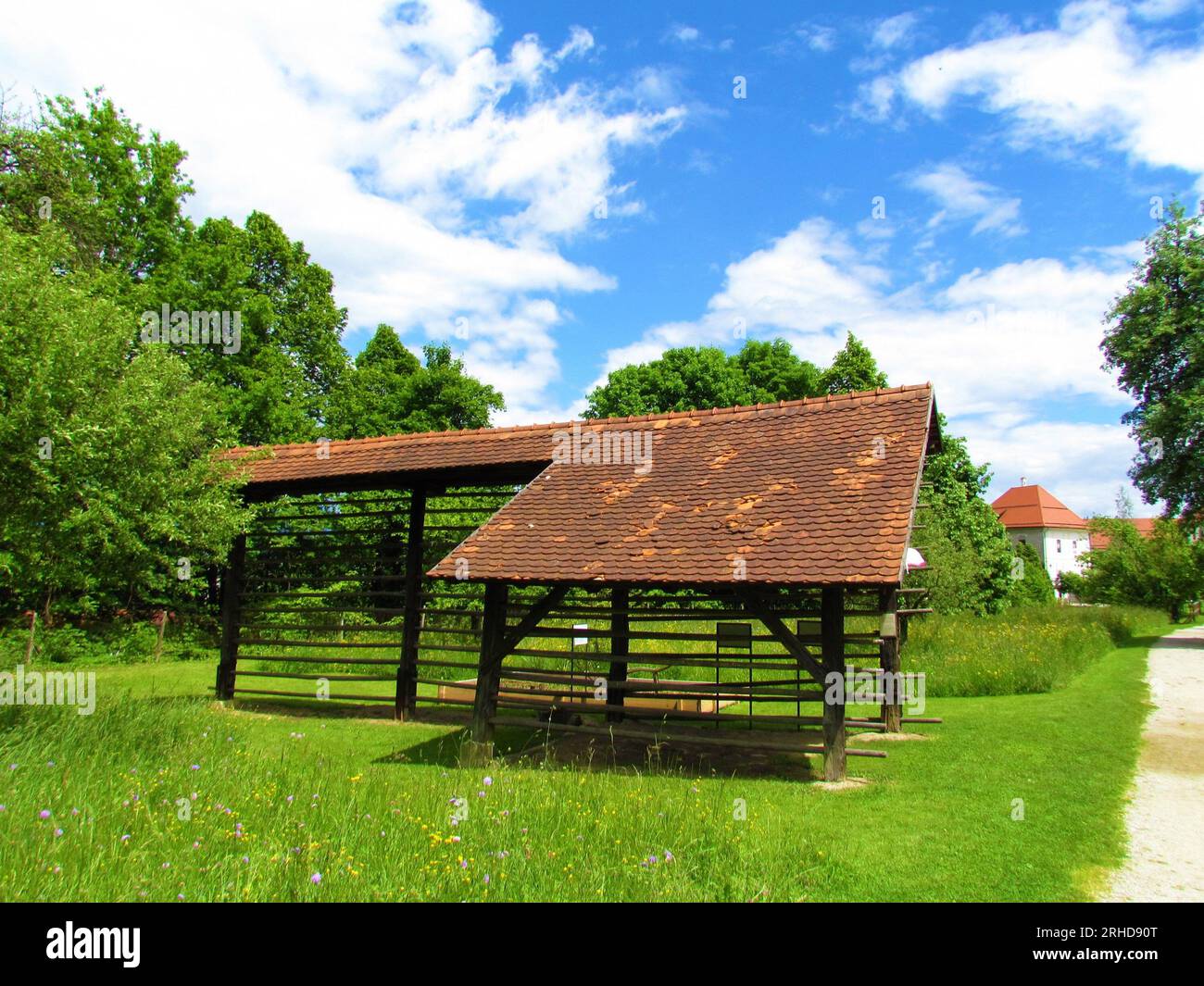 Traditional hayrack building in Gorenjska, Slovenia with a red roof and ...