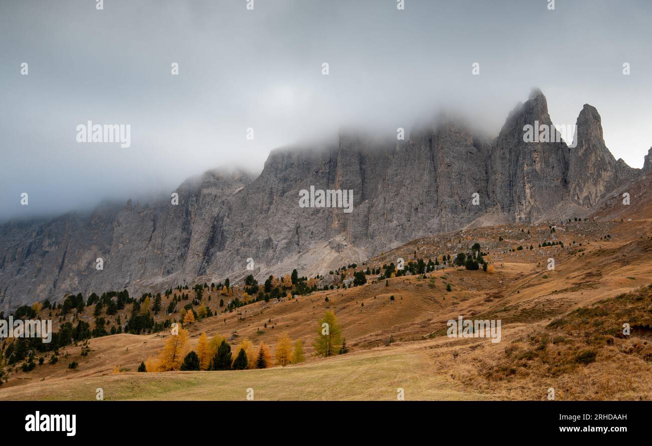 Mountain landscape of dolomites covered with fog in autumn. Nature ...