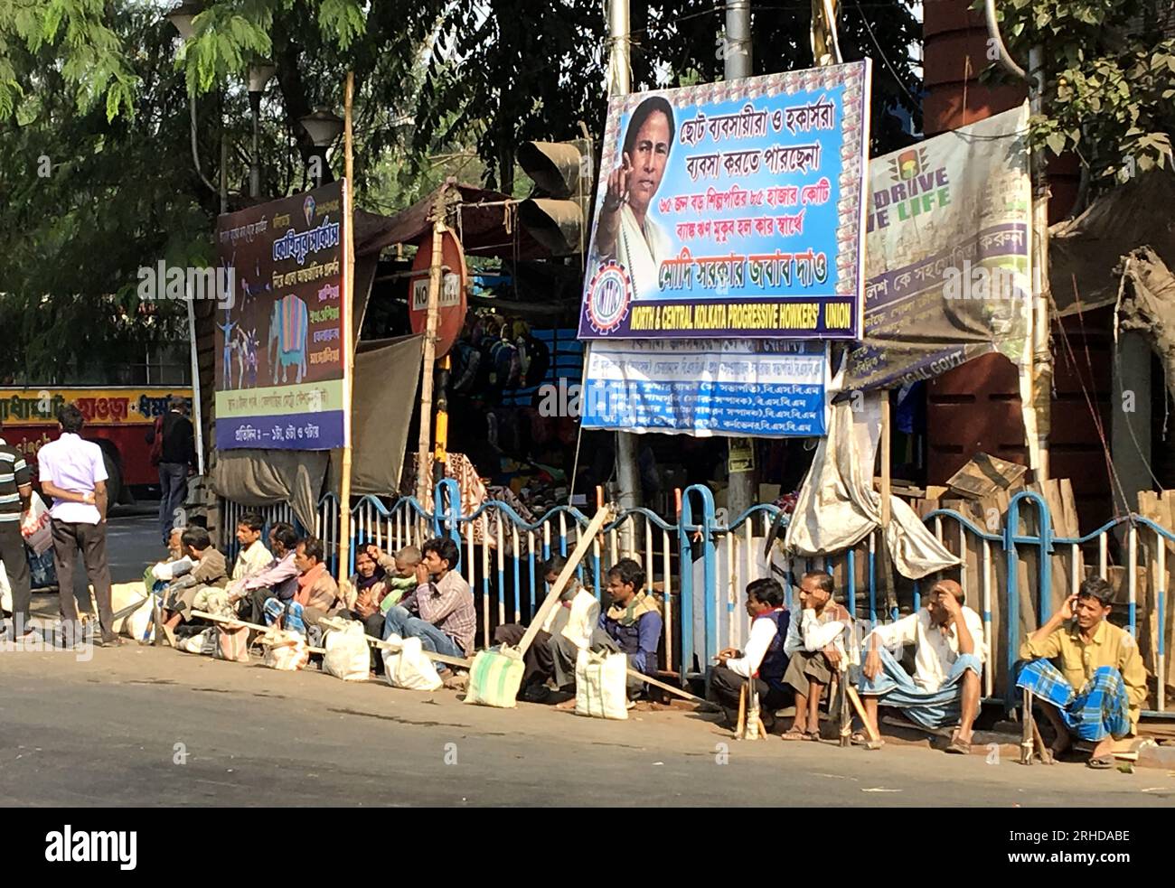 Laborers hoping for work on a street corner in Kolkata, Bengal, India ...